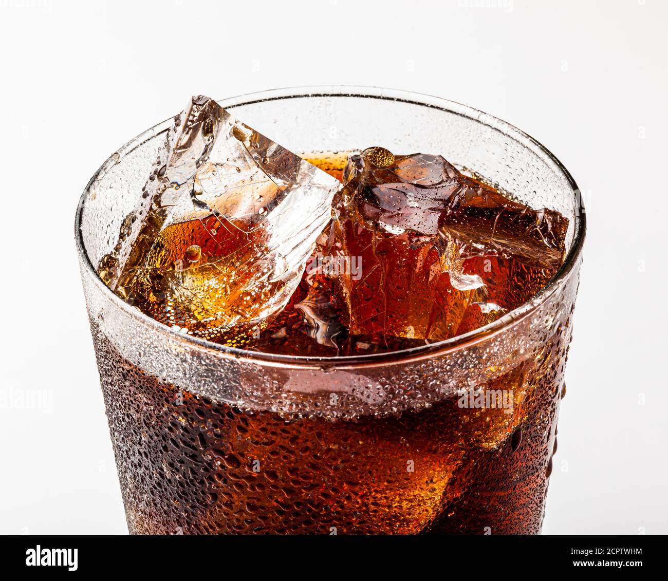 Ice cold refreshing carbonated summer drink with ice chunks in a glass ...