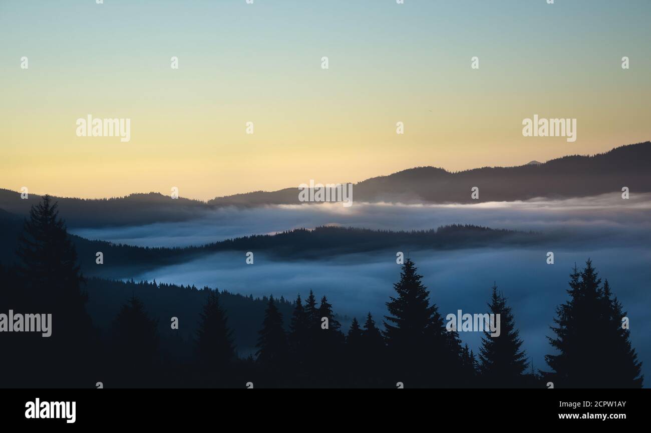 Over the clouds view, mountains in the background, sun rising time ...