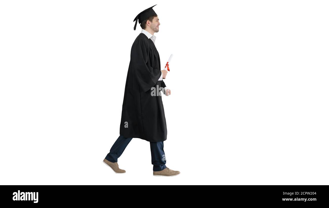 Happy male student in graduation robe walking and kissing his di Stock ...
