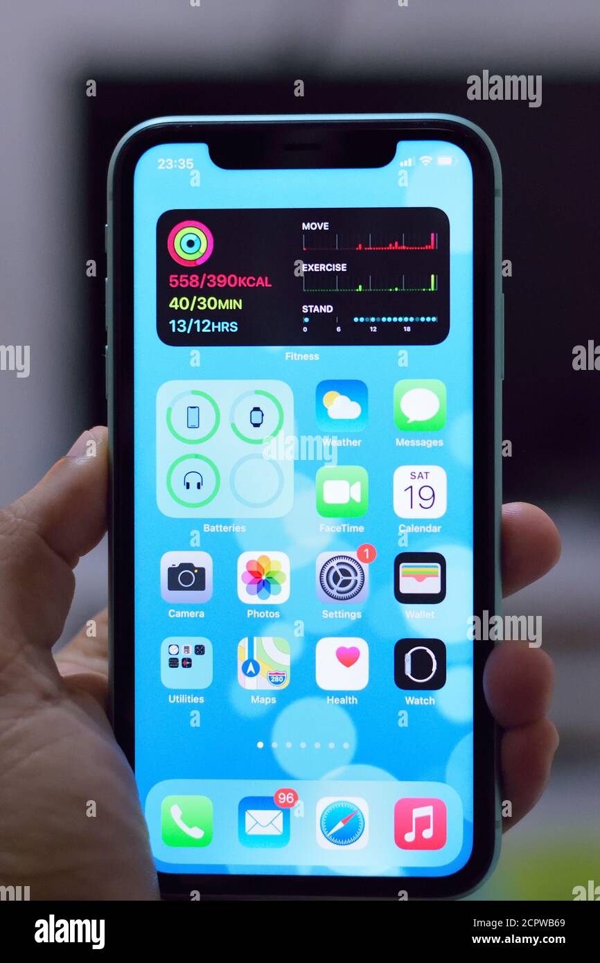 iPhone 11 with new home screen widgets of iOS14. The latest version of ...