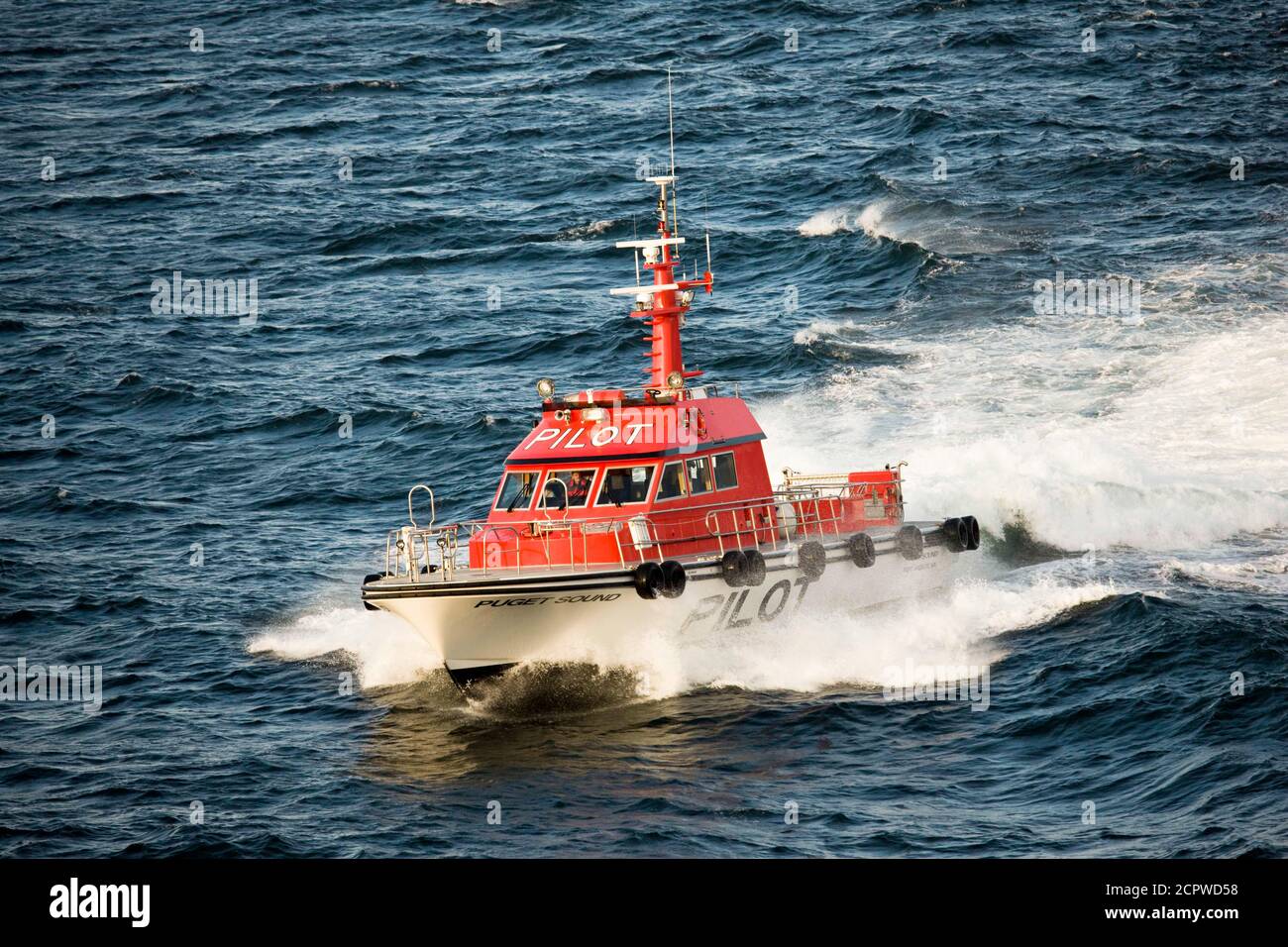 Pilot boat as it approaches a cruise ship Stock Photo - Alamy