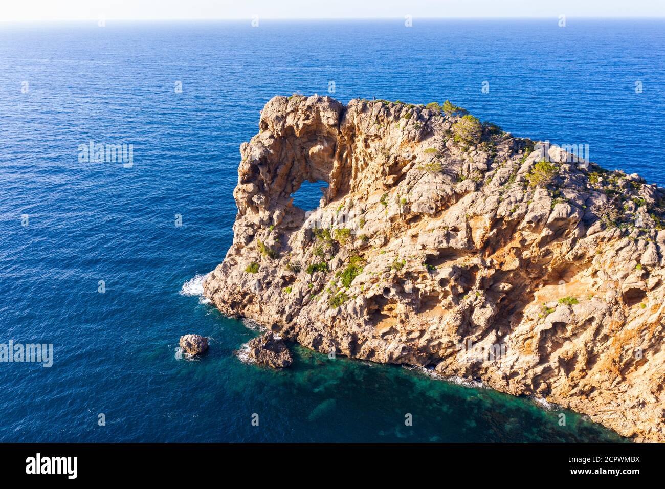 Sa Foradada peninsula with rock hole, near Deia, Serra de Tramuntana ...