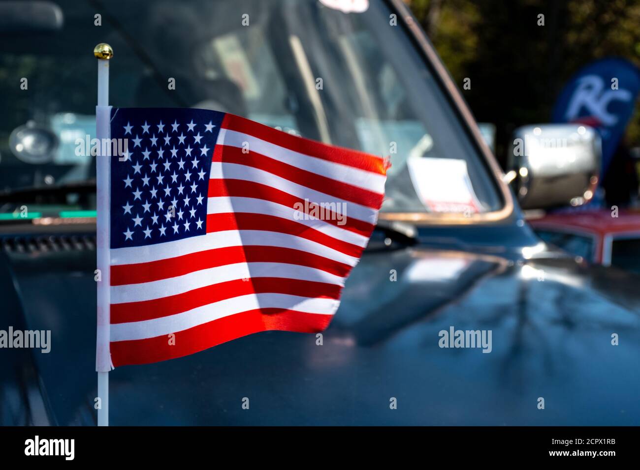 American flag waving on the car Stock Photo - Alamy