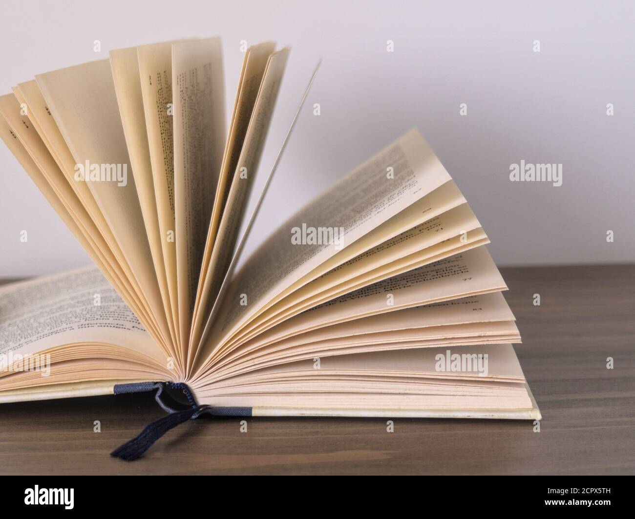 Close up of an open book with yellowish pages Stock Photo - Alamy