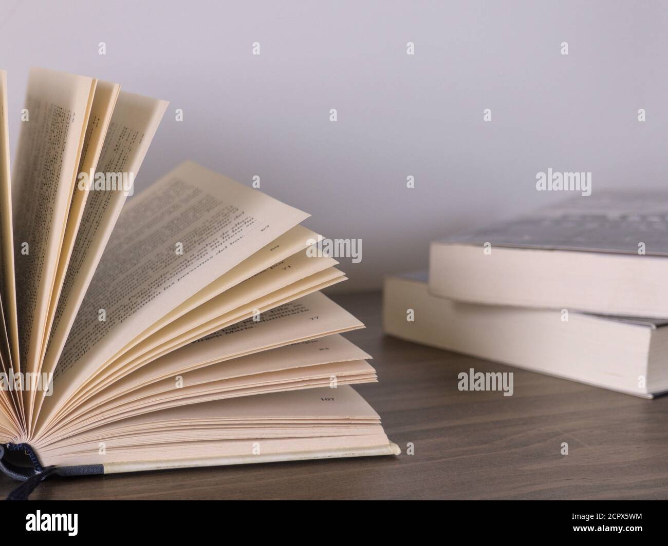 Close up of an open book with yellowish pages Stock Photo - Alamy