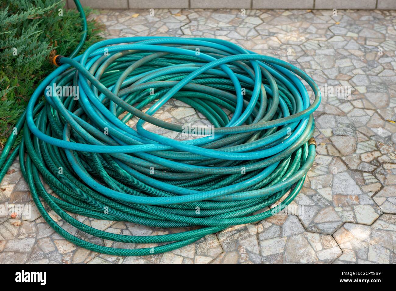 Hose on the ground hi-res stock photography and images - Alamy