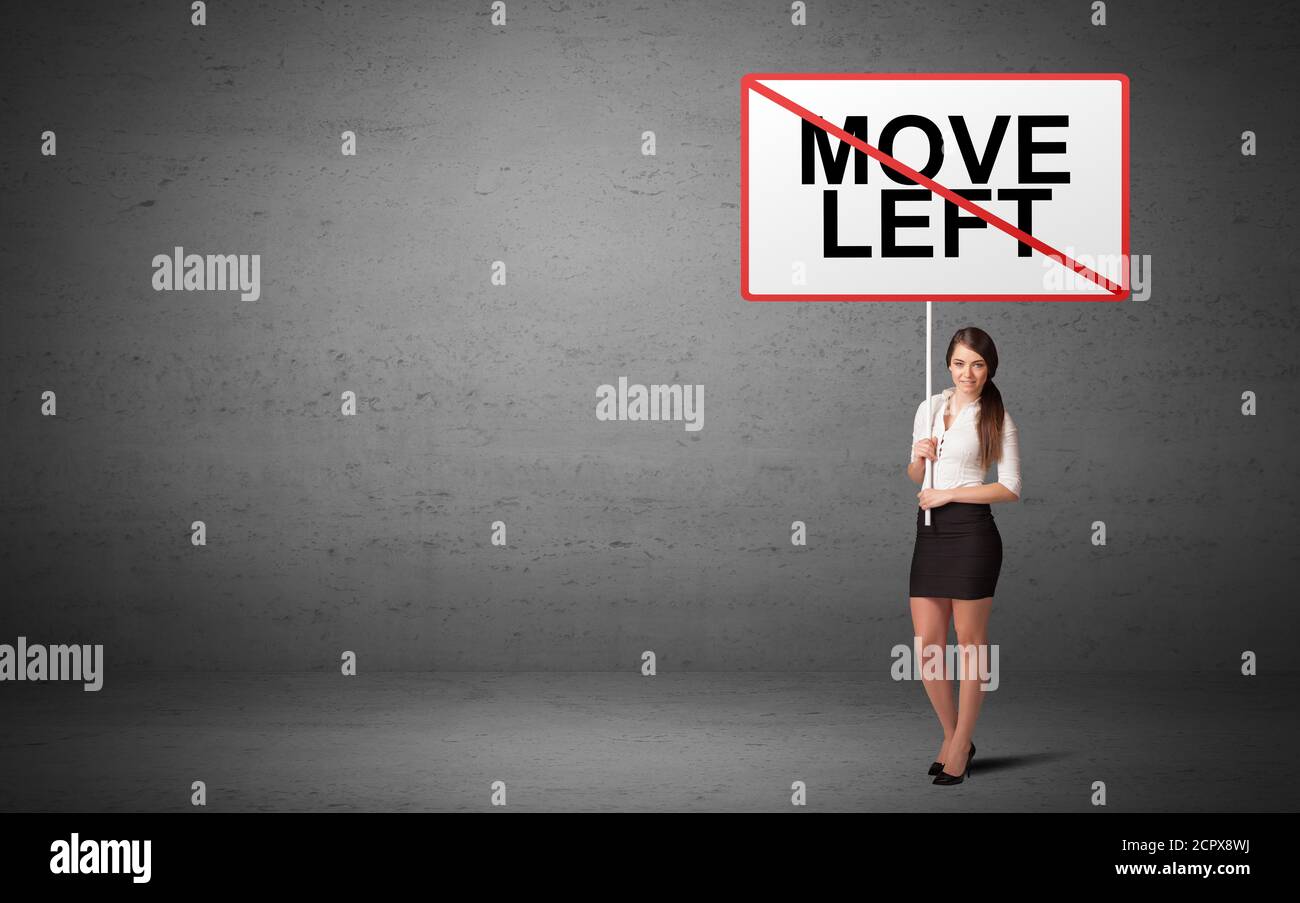 business person holding a traffic sign with MOVE LEFT inscription, new ...