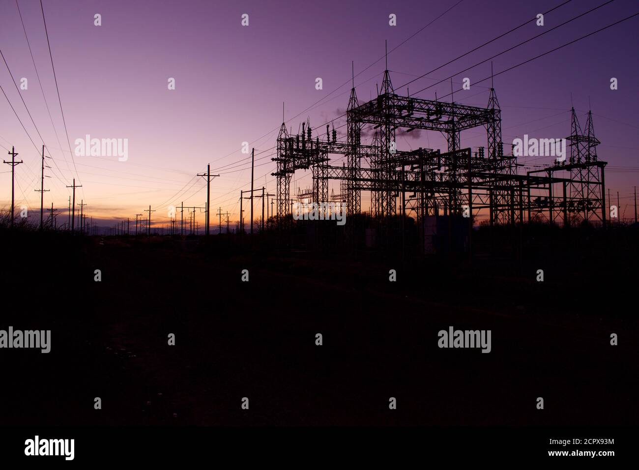 Vivid sunset backlight electrical power station Stock Photo - Alamy