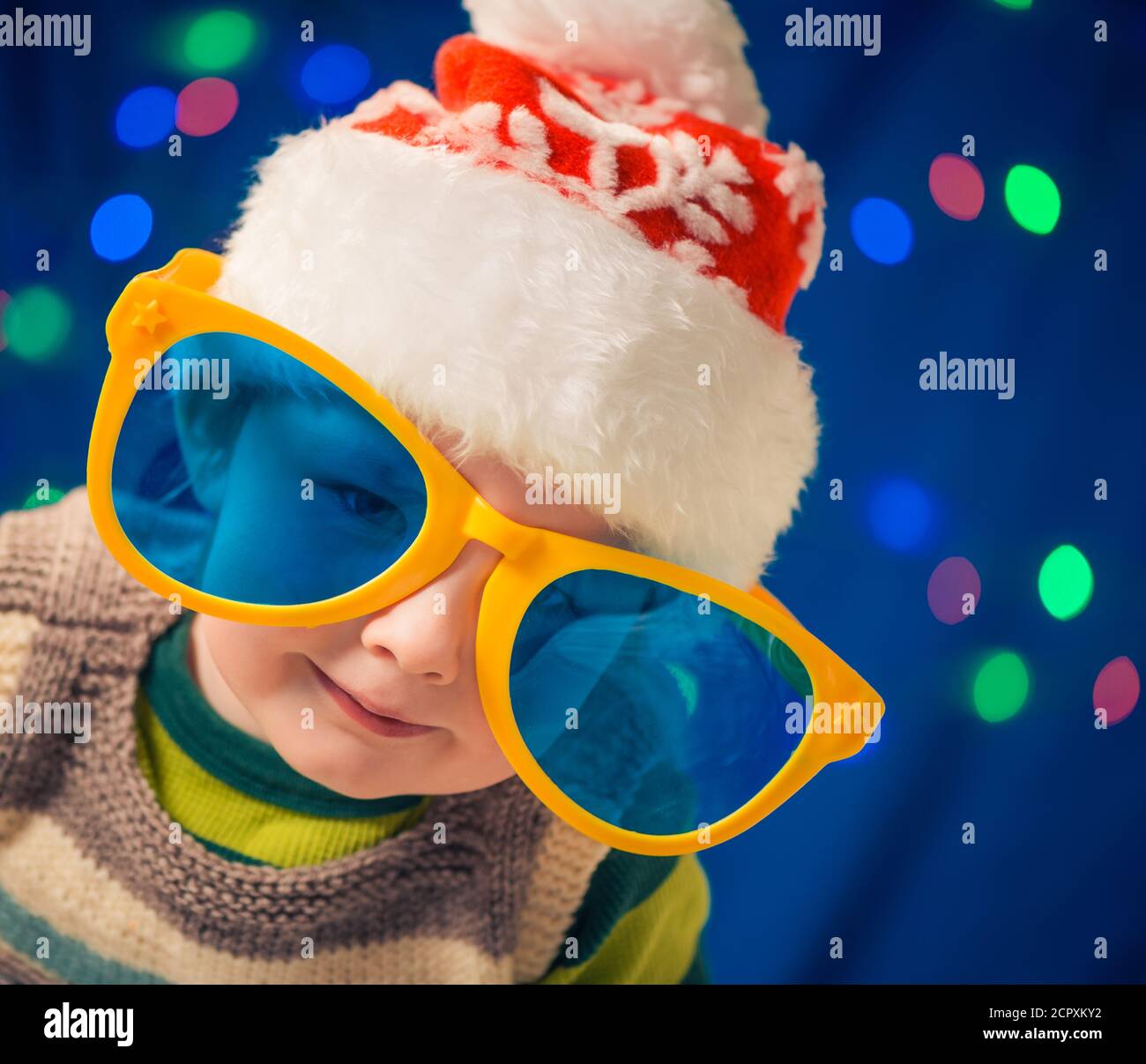 little boy portrait on holiday lights background Stock Photo - Alamy