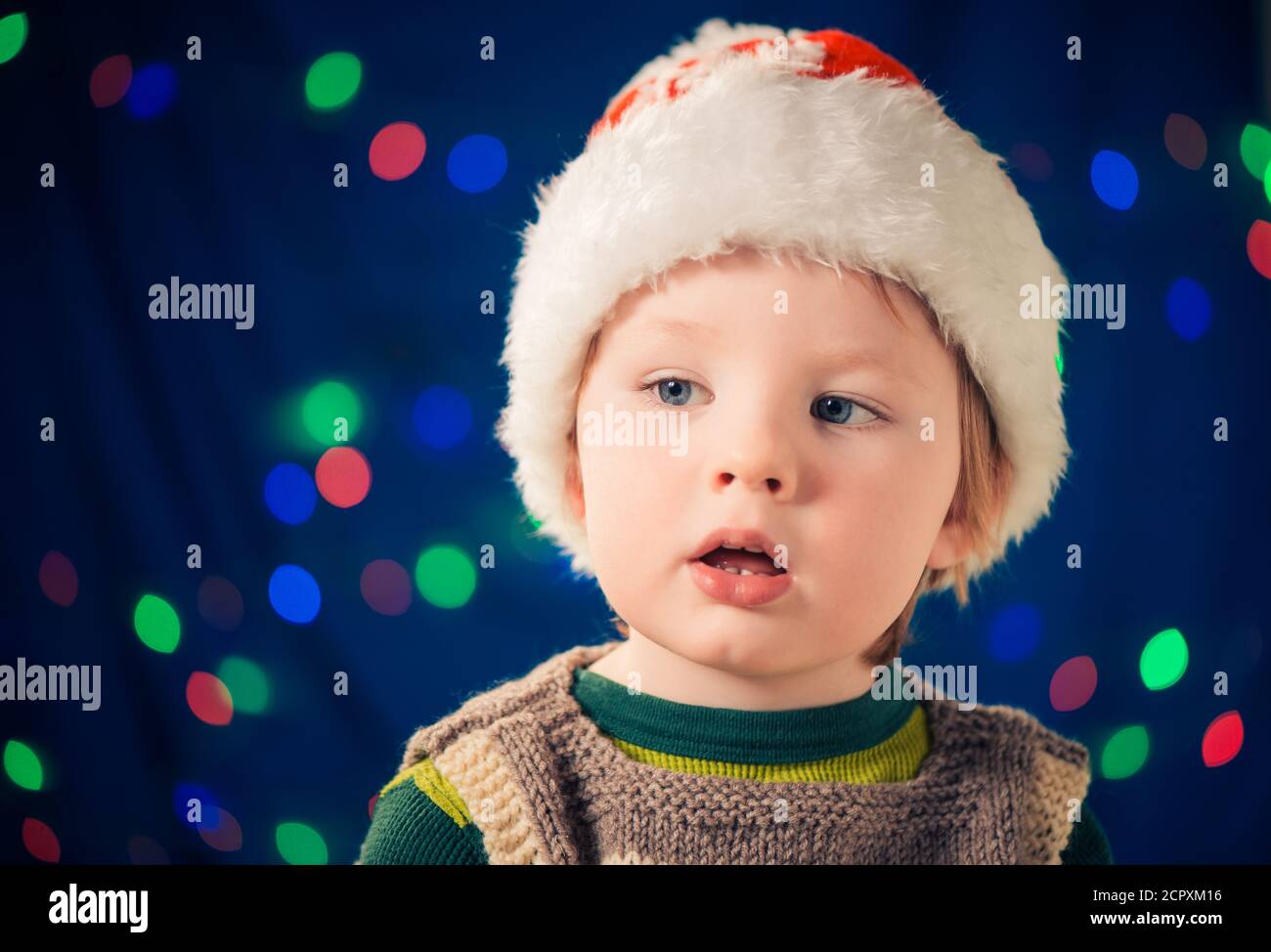 little boy portrait on holiday lights background Stock Photo - Alamy