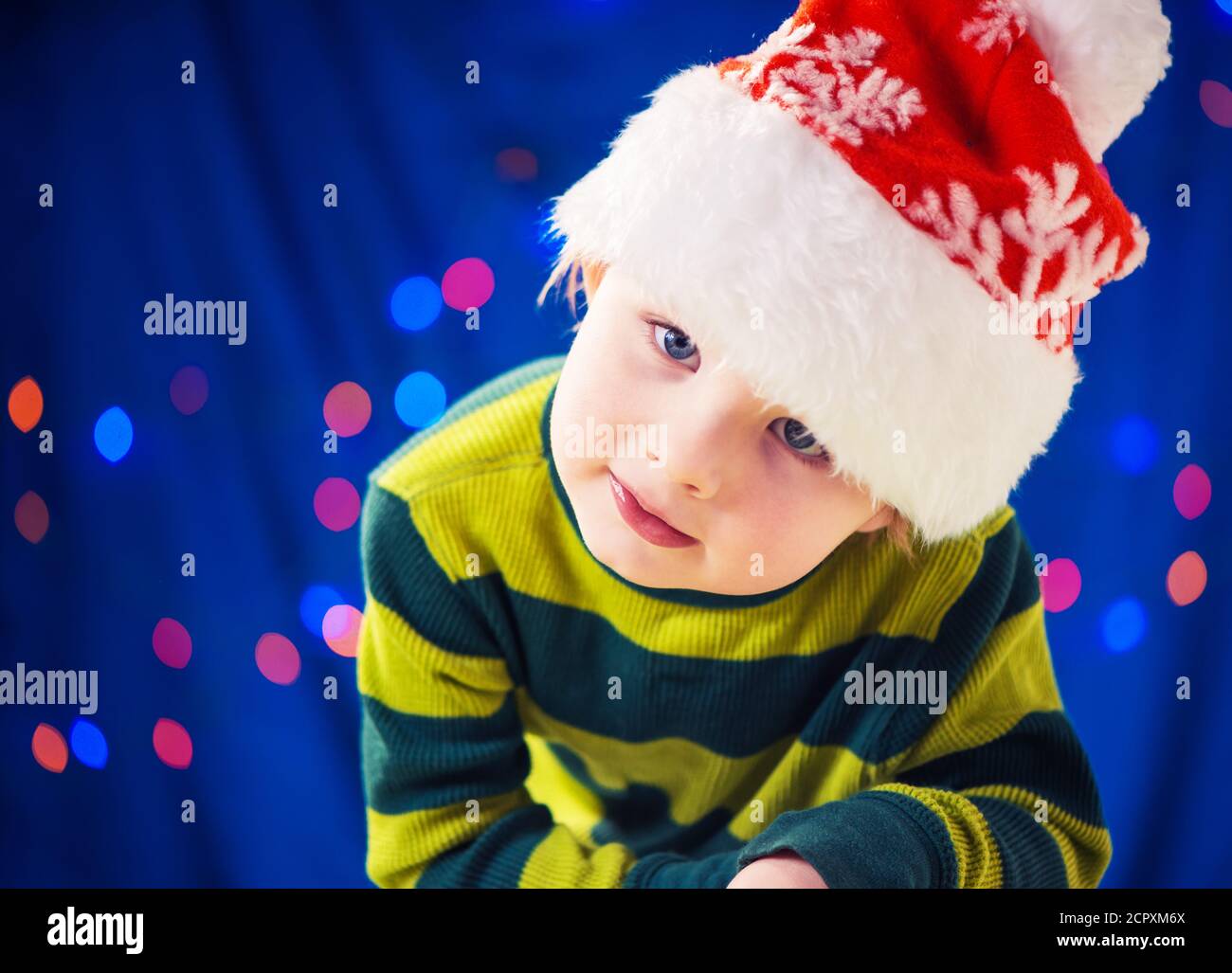 little boy portrait on holiday lights background Stock Photo - Alamy