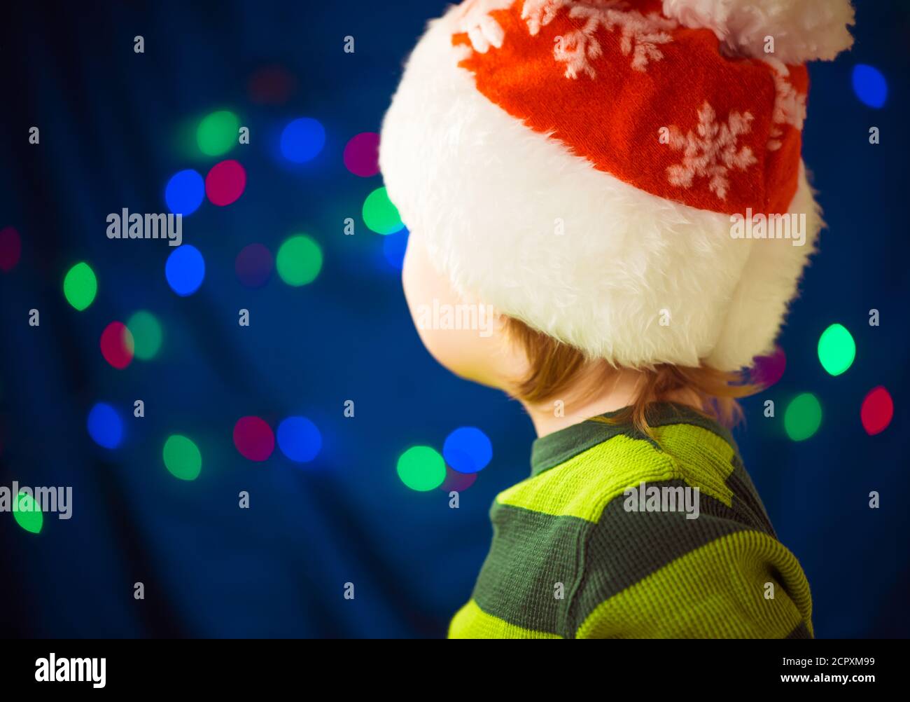 little boy portrait on holiday lights background Stock Photo - Alamy