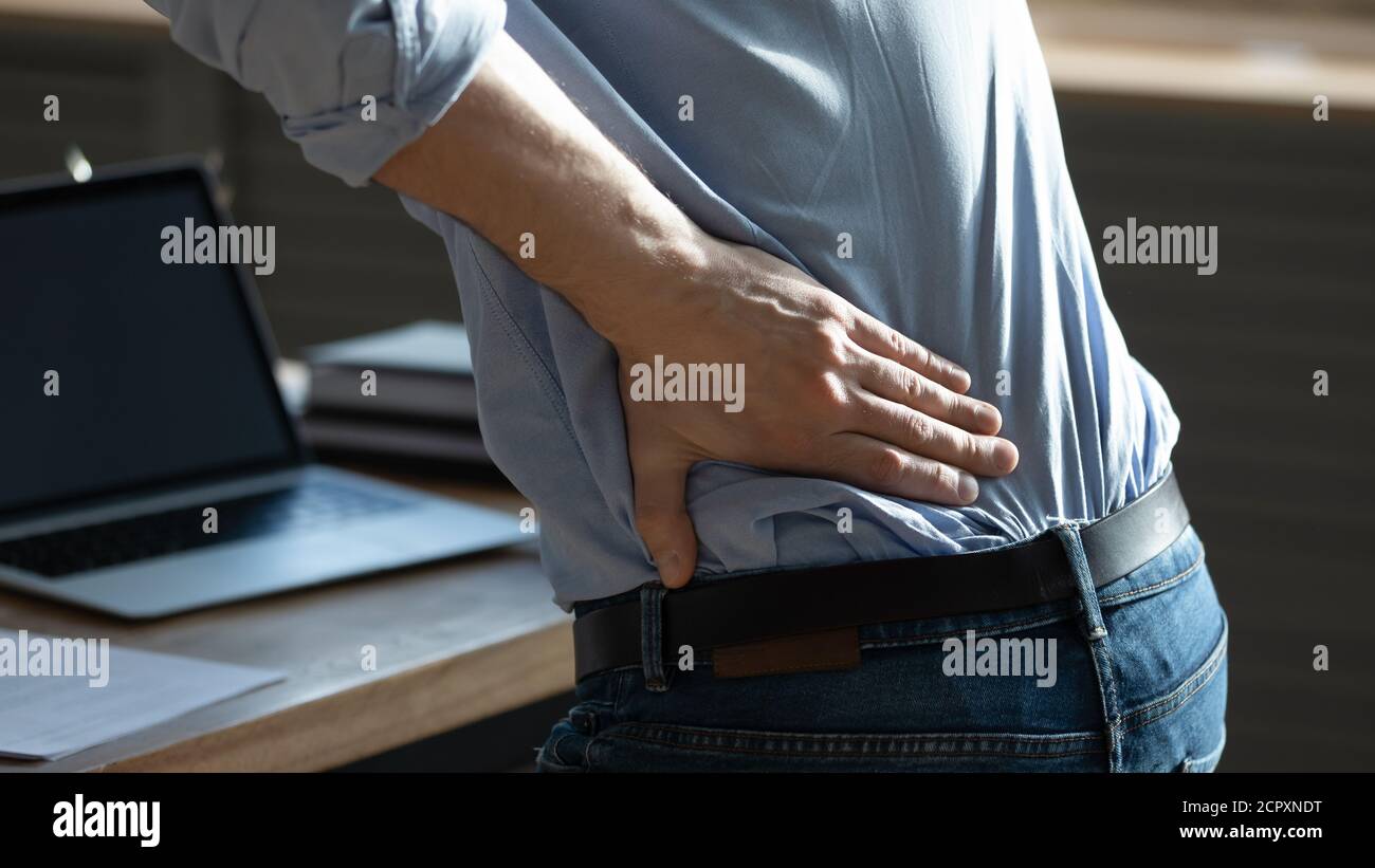 Close up of unhealthy man struggle with back pain Stock Photo - Alamy