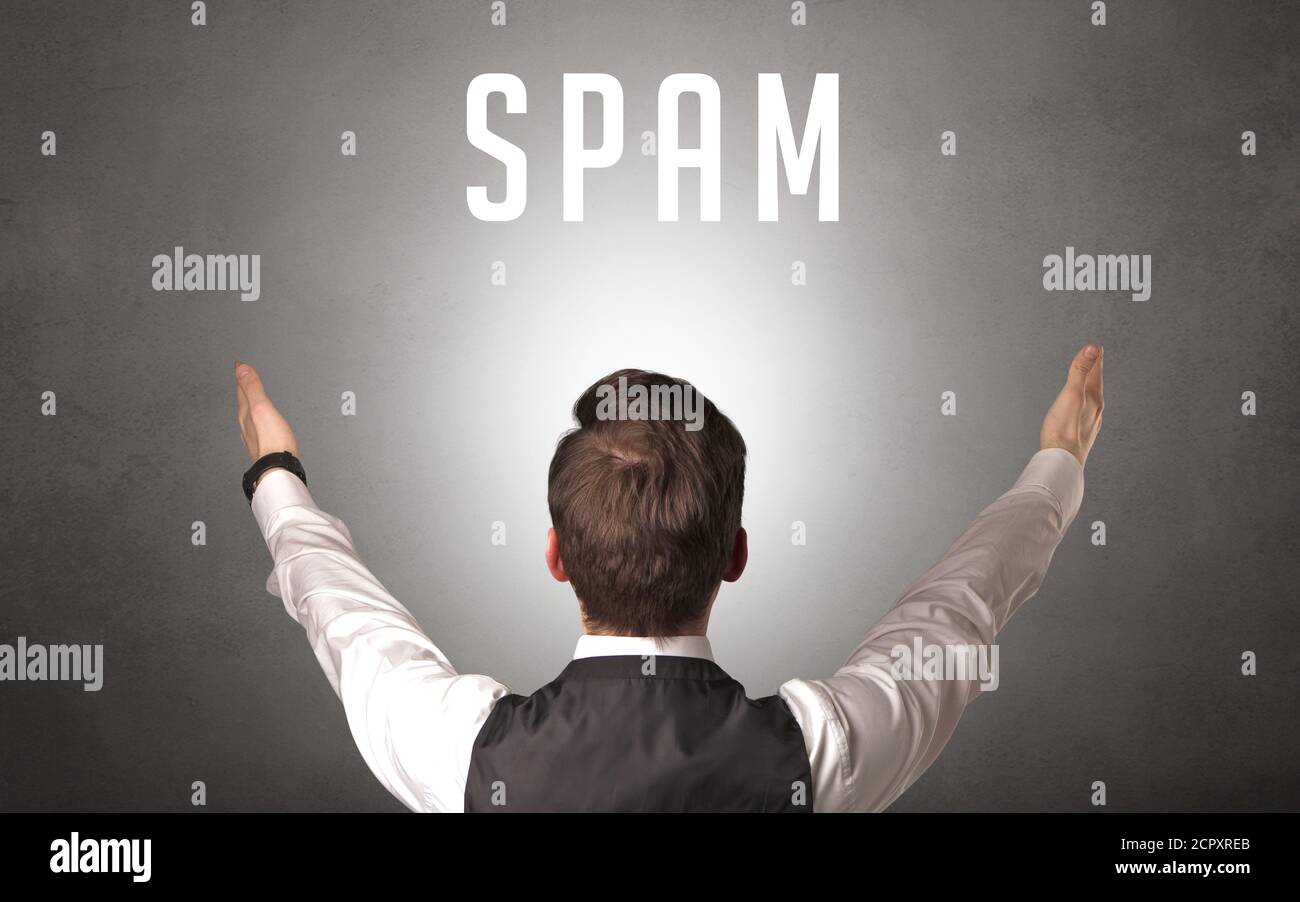Rear view of a businessman with SPAM inscription, cyber security ...