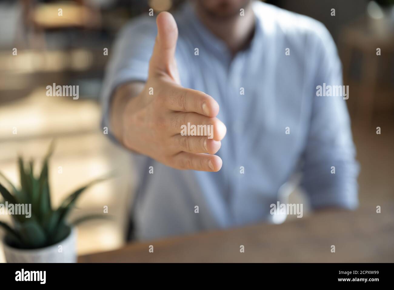Close up of male worker stretch hand greeting Stock Photo - Alamy