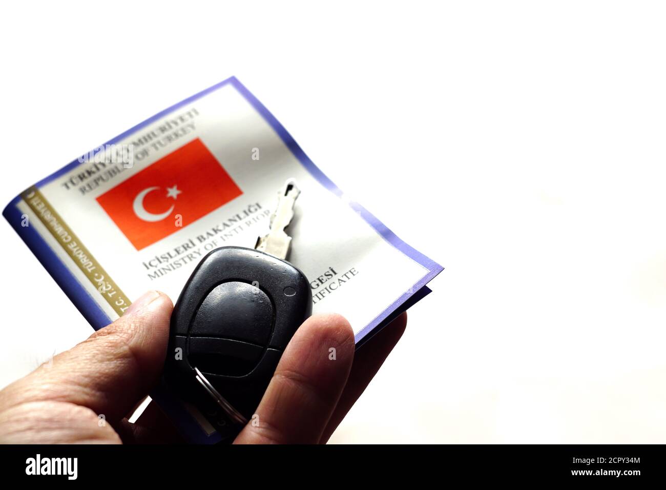 Car key and Turkish registration licence on isolated background close ...