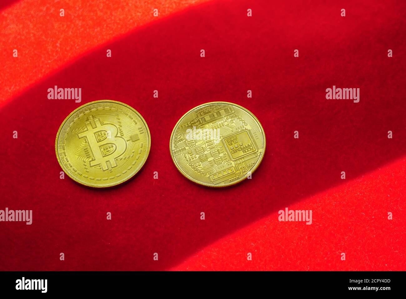 Bitcoin symbol coins on red velvet background Stock Photo - Alamy