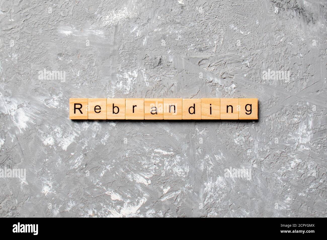 rebranding word written on wood block. rebranding text on table ...