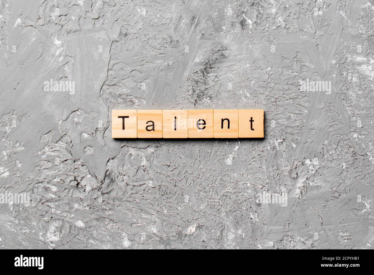 Talent word written on wood block. Talent text on cement table for your ...