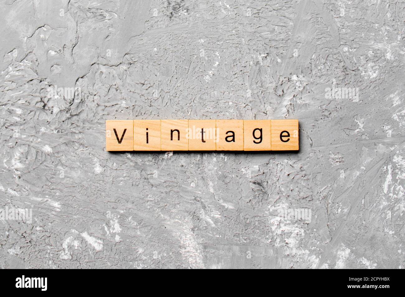 vintage word written on wood block. vintage text on cement table for ...
