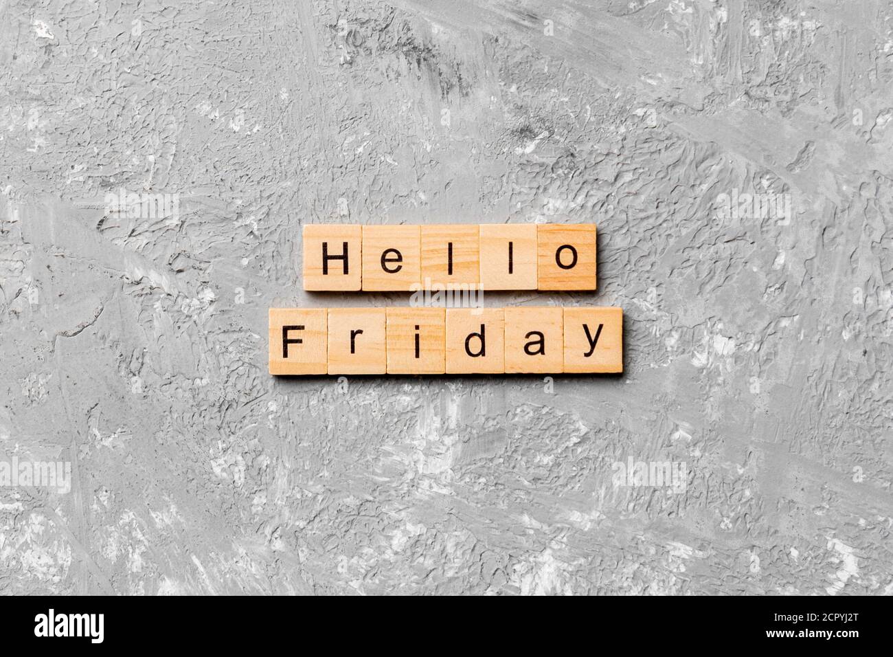 hello friday word written on wood block. hello friday text on cement ...