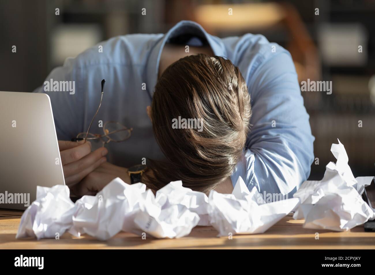 Tired male employee fall asleep at workplace Stock Photo - Alamy