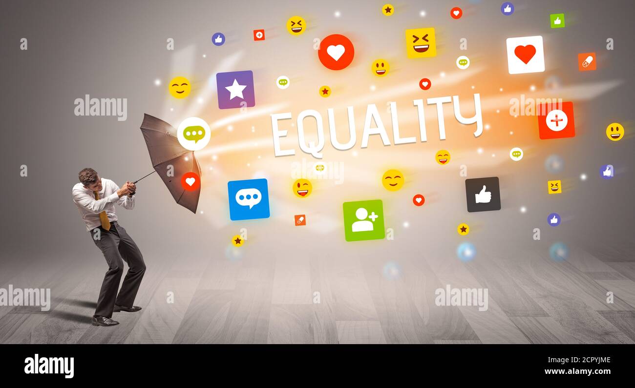 Handsome businessman defending with umbrella from EQUALITY inscription ...