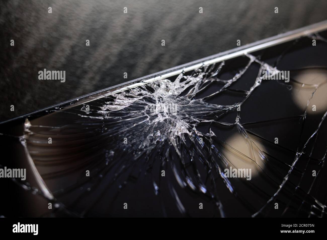 Broken mobile phone display, cracks close up Stock Photo - Alamy