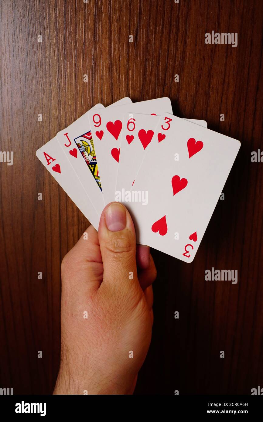 Four aces in hand cards hi-res stock photography and images - Alamy