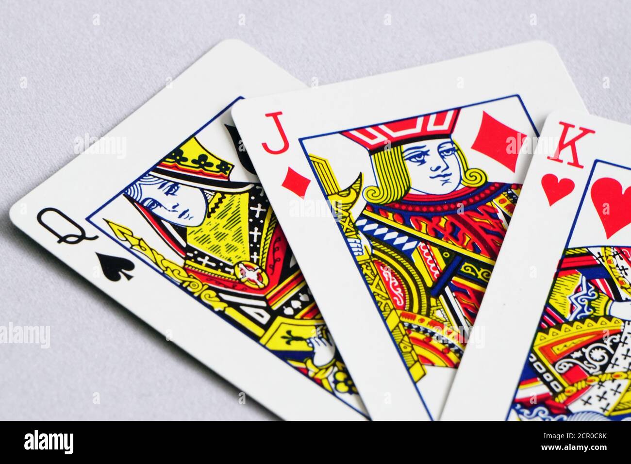 Assorted play cards and combinations on isolated white background close ...