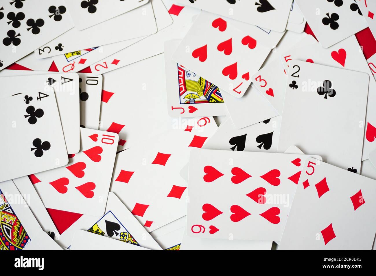 Assorted play cards and combinations on isolated white background close ...