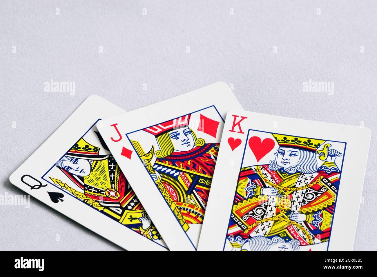Assorted play cards and combinations on isolated white background close ...