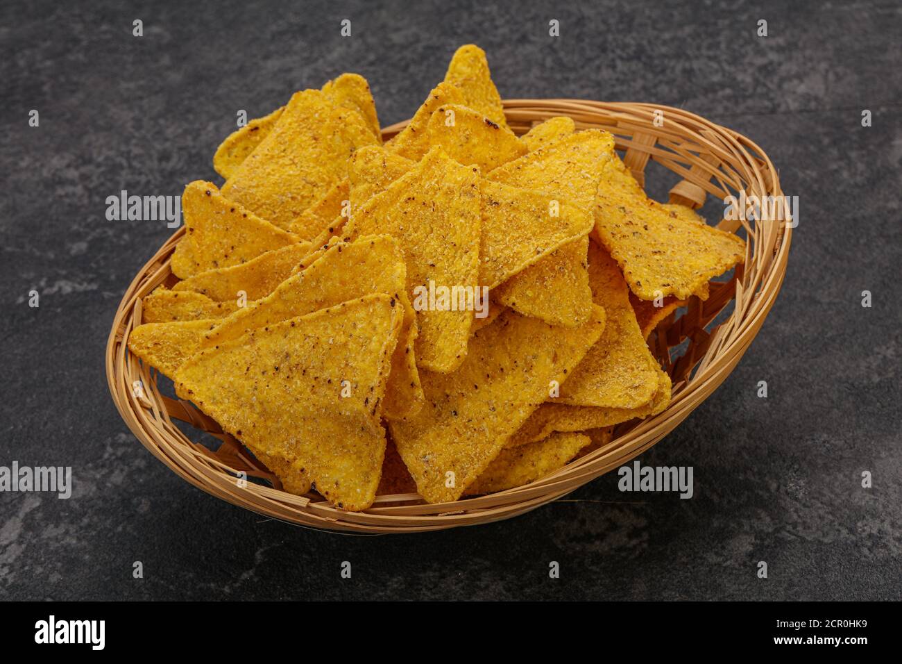 Mexican crunchy corn nachos triangle heap Stock Photo - Alamy