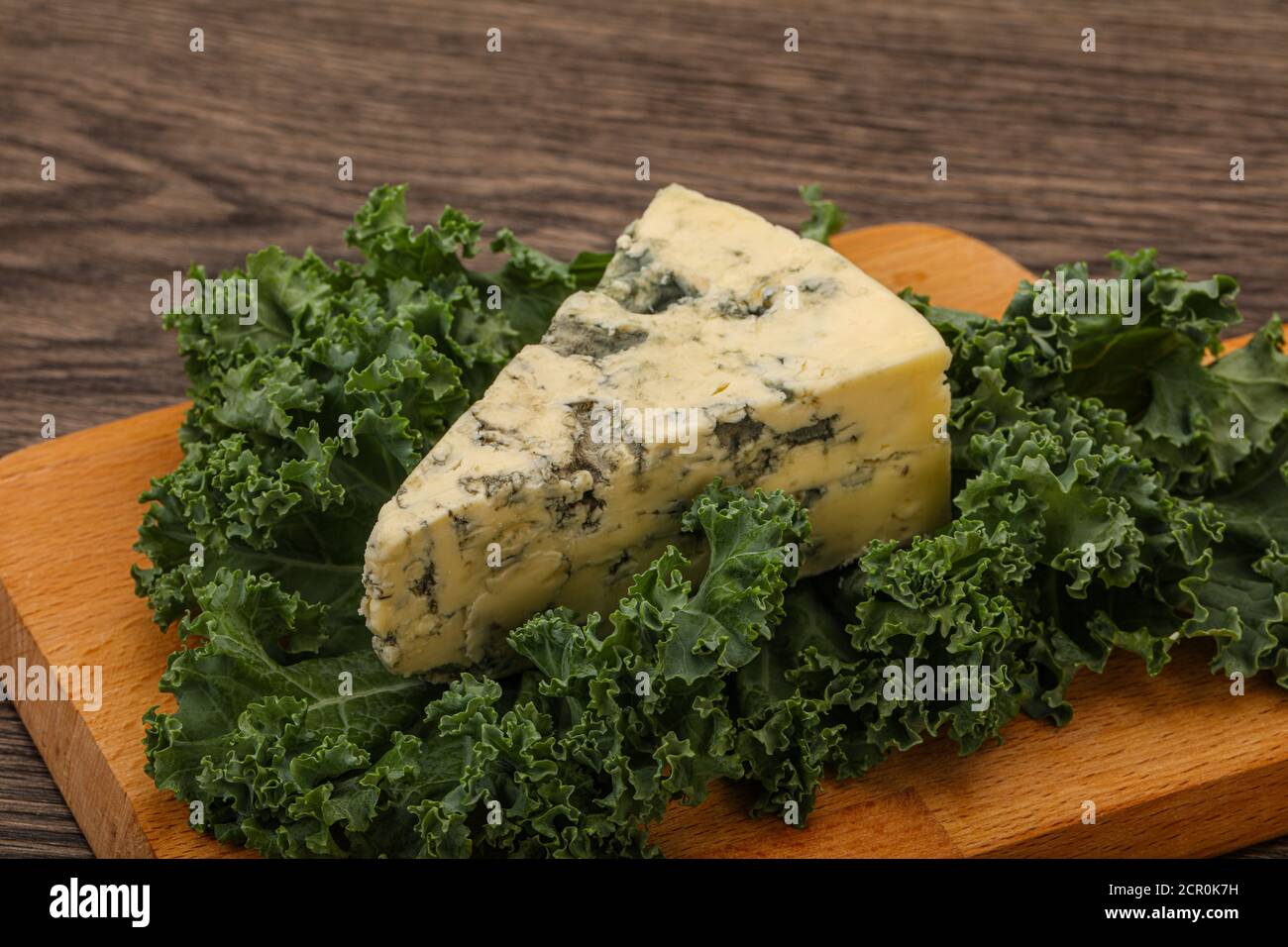 Dairy Blue cheese triangle with mold Stock Photo - Alamy