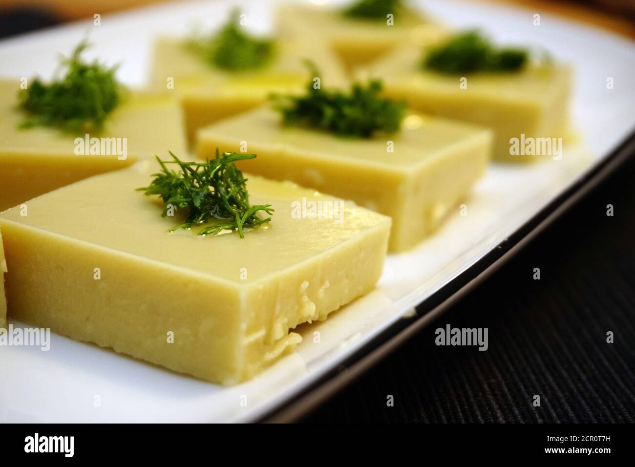 Mashed broad beans fava appetizer cube shaped in the dish Stock Photo ...