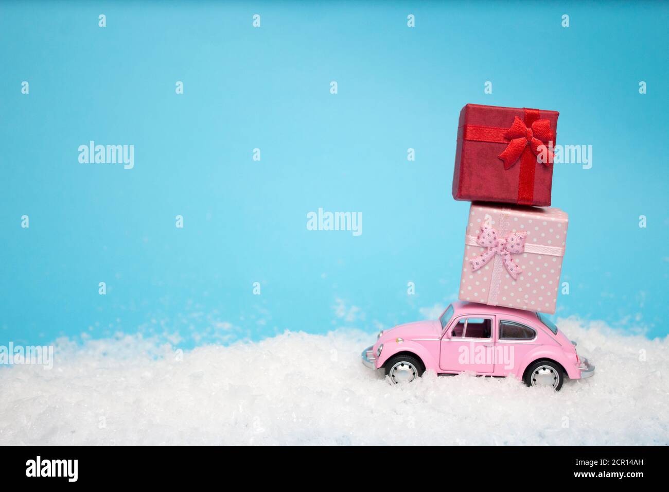 Little toy car rides in the snow and taking boxes with gifts, Christmas ...