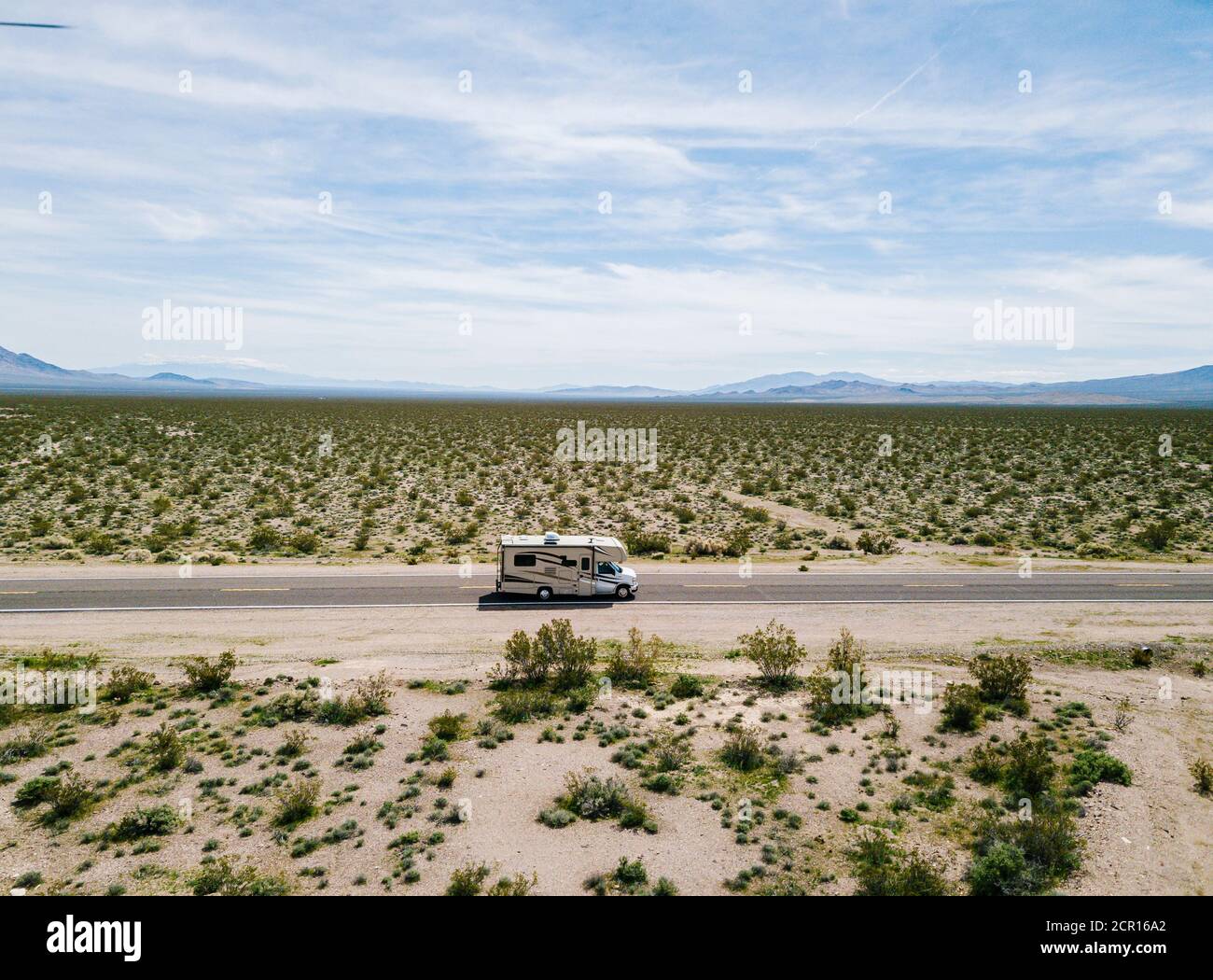 Motorhome driving on a highway in the desert Stock Photo - Alamy