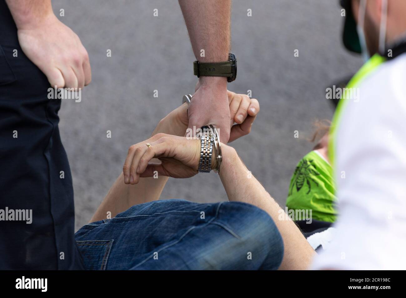 Arrested handcuffs hi-res stock photography and images - Alamy