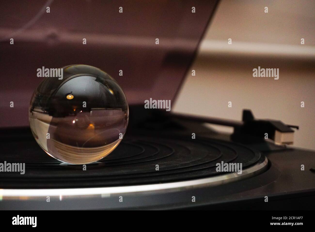 Glass sphere with reverse reflection in hand Stock Photo - Alamy