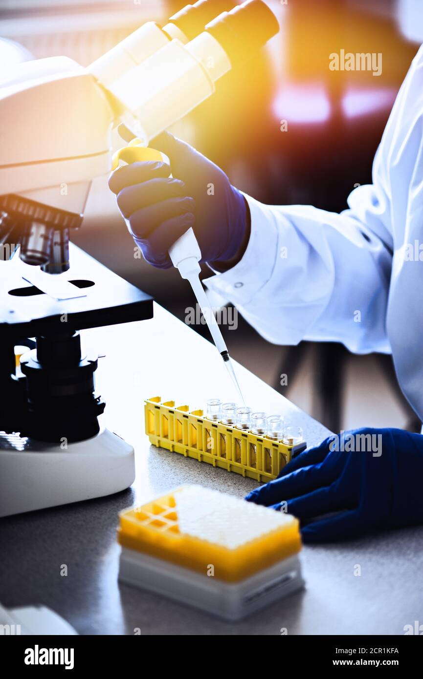 Variable volume multichannel pipette. Medical worker, scientist ...