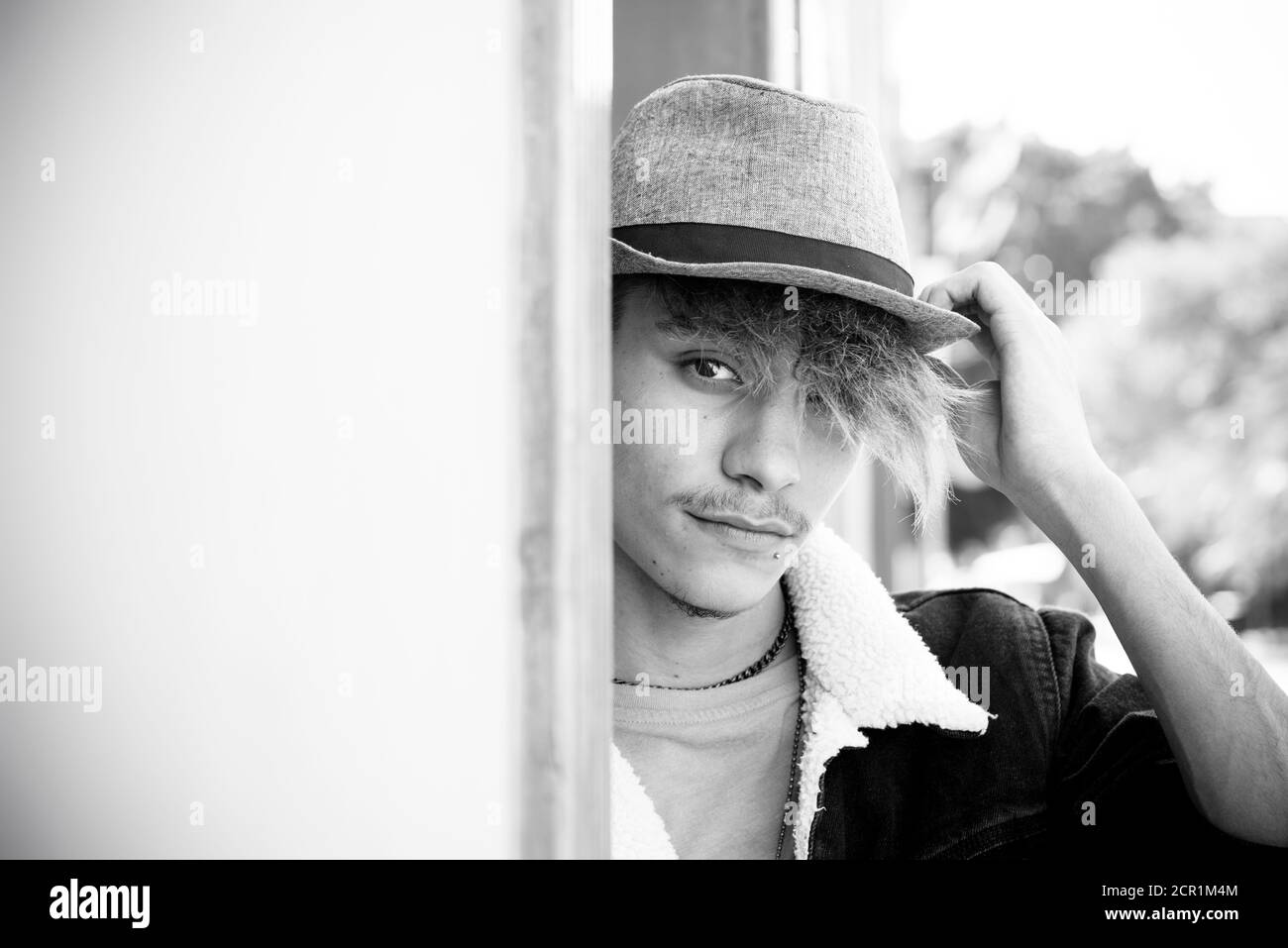 Black and white alternative young boy teenager portrait looking on ...