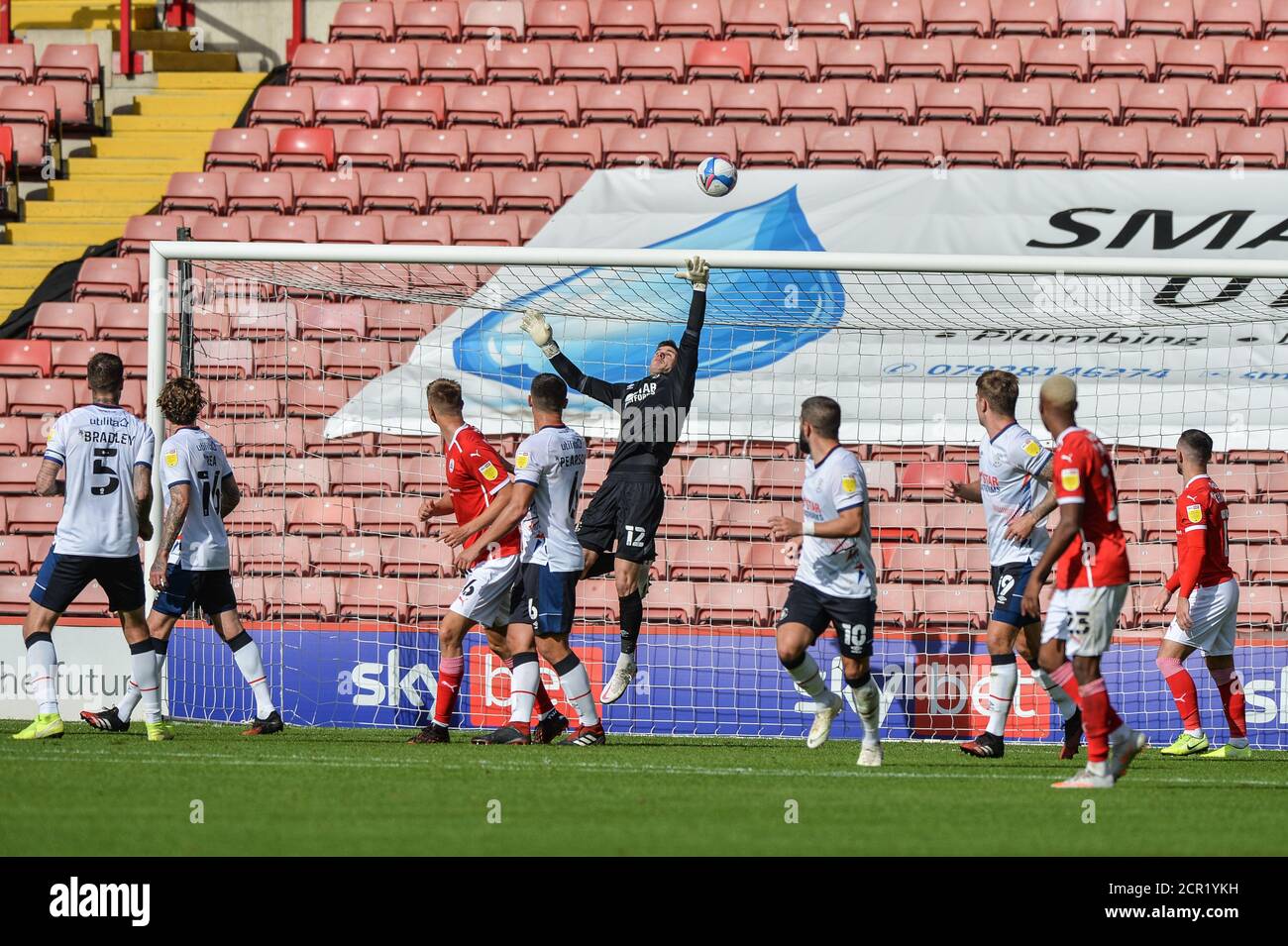 Goalkeeper Simon Sluga (1) of Luton Town tips the ball over the net ...