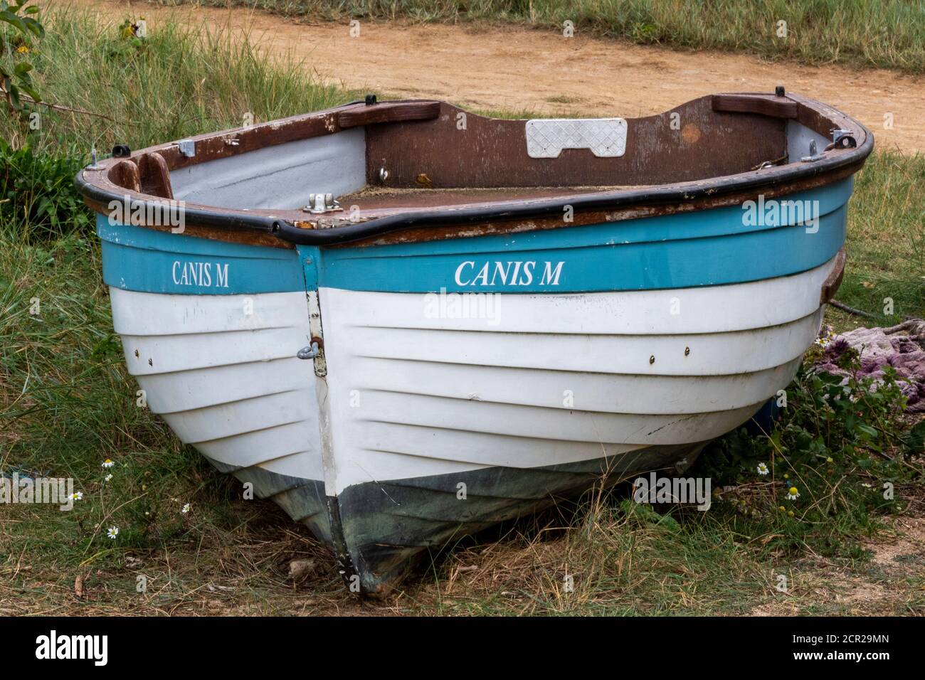 an old fashioned traditional clinker built wooden dinghy or boat high ...