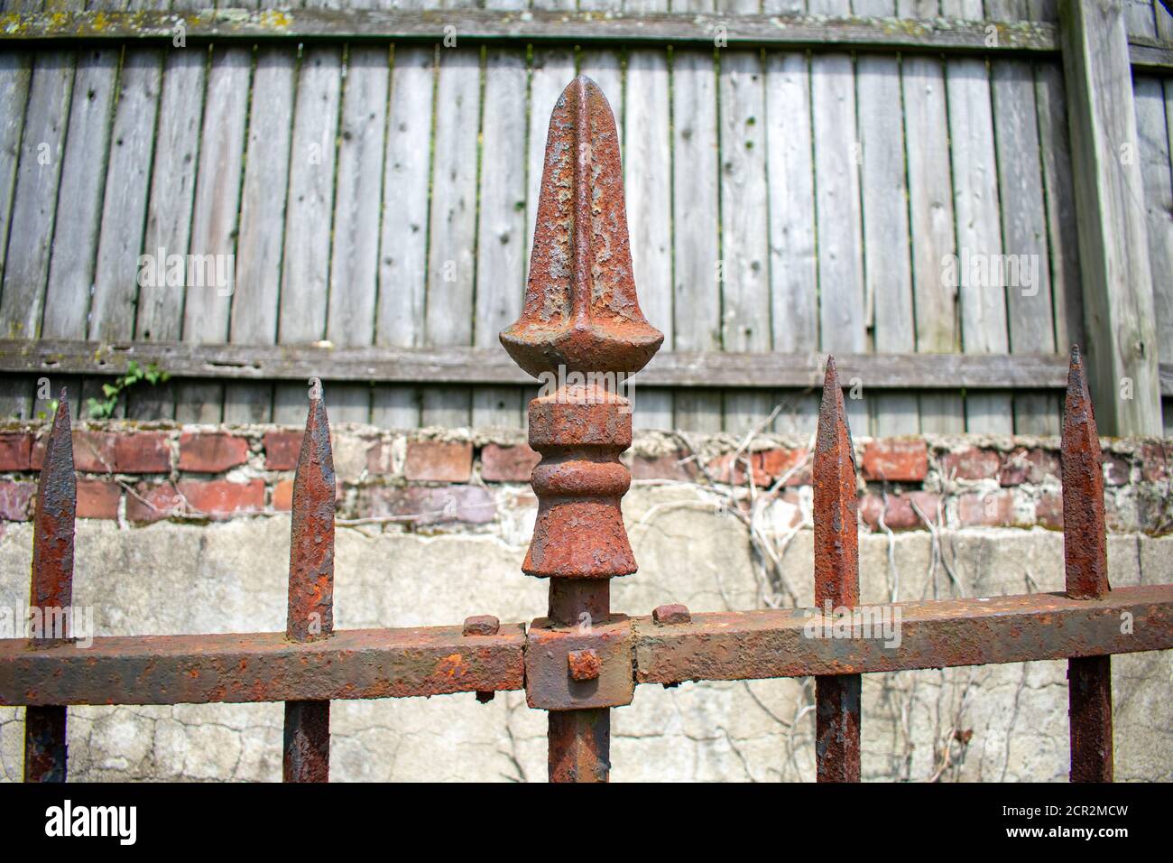 A Rusty Spike on an Old Black Metal Fence Stock Photo - Alamy