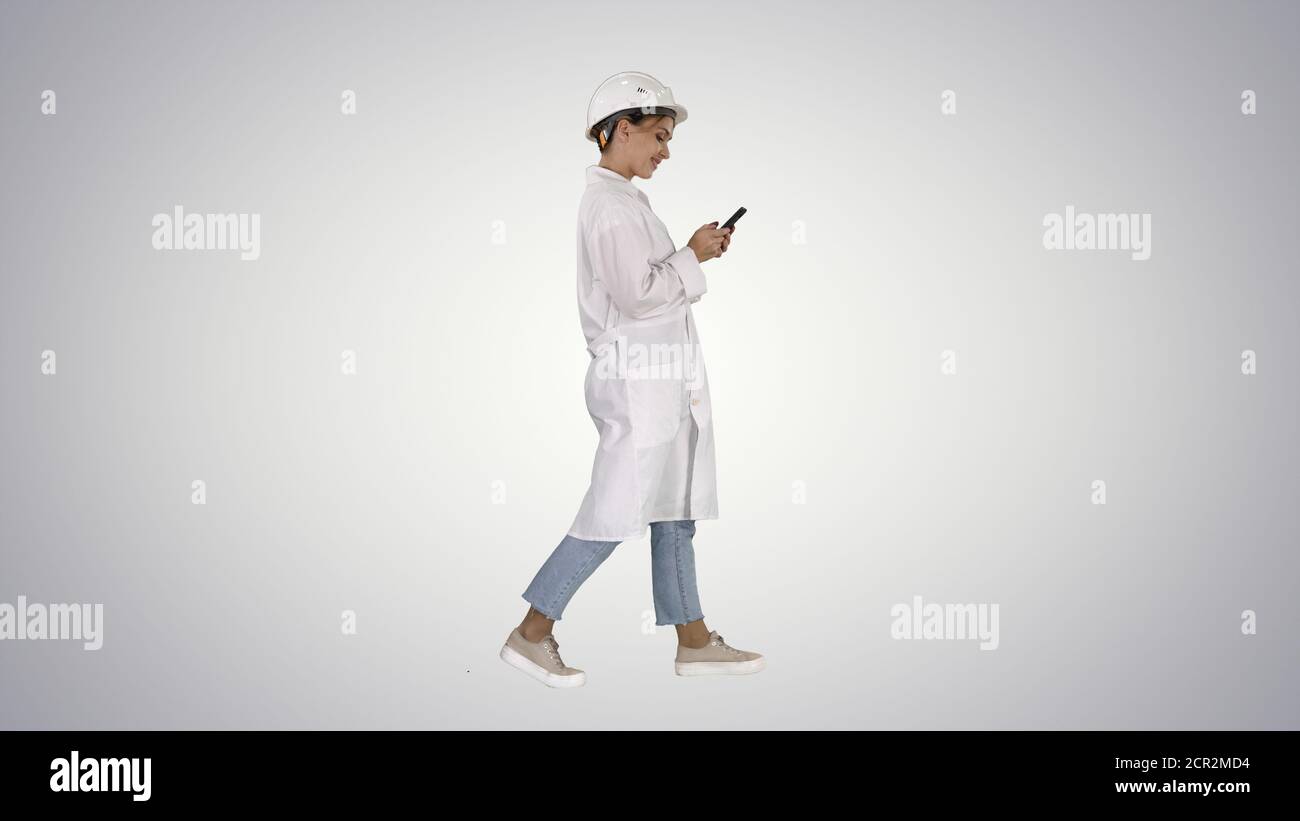 Female Scientist Using Smartphone Walking on gradient background Stock ...