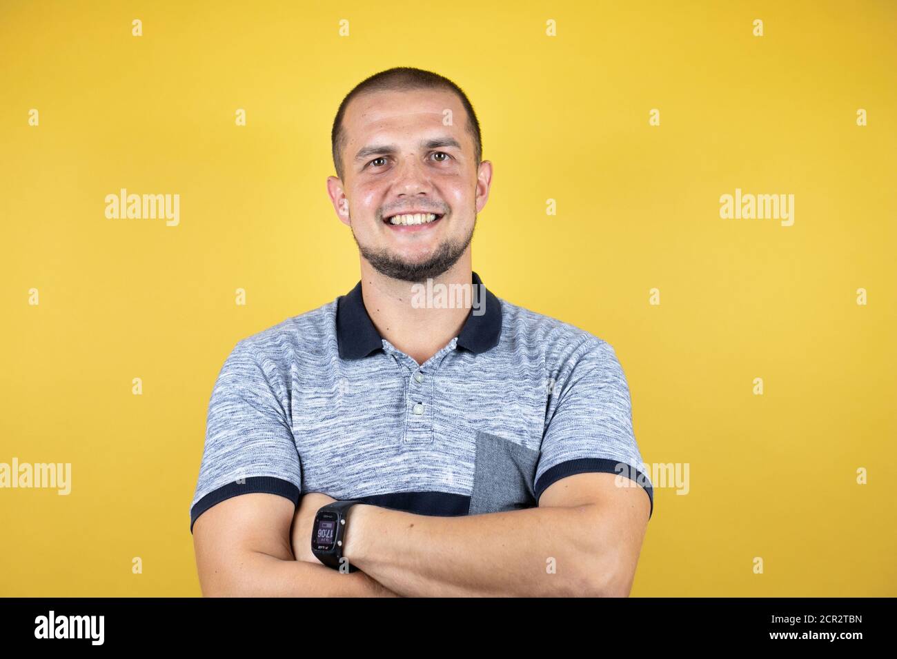 Russian man standing over insolated yellow background happy face ...
