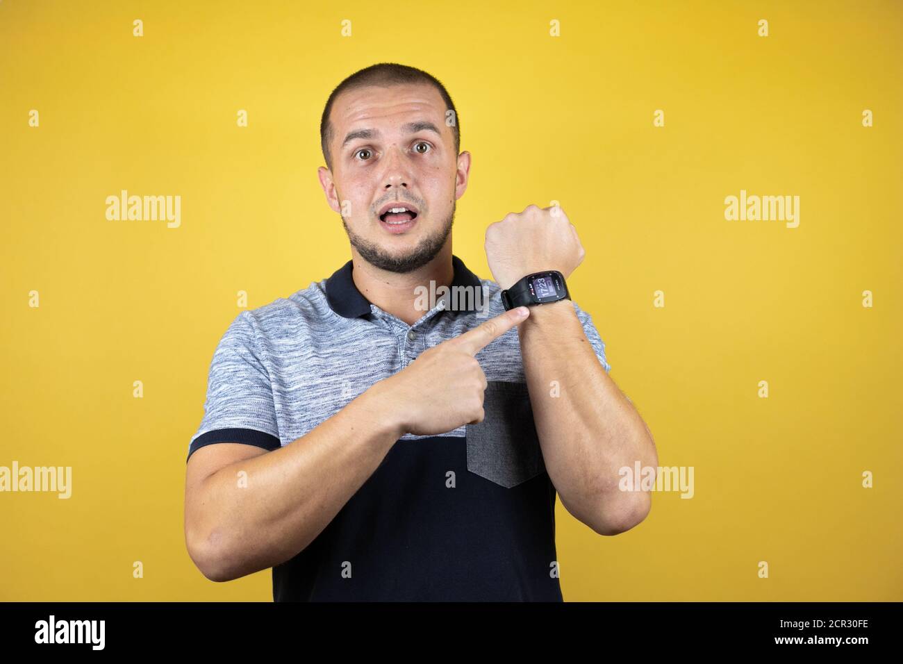 Russian man standing over insolated yellow background surprised and ...