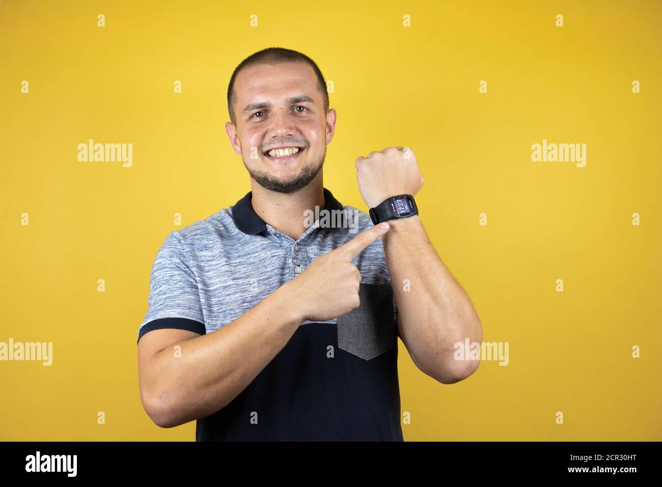 Russian man standing over insolated yellow background surprised and ...