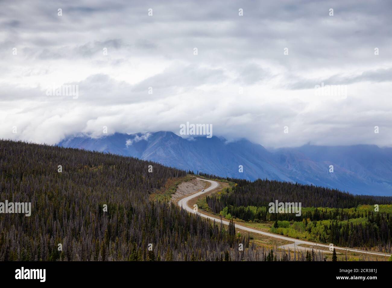 Scenic Route, Alaska Hwy, during a sunny and cloudy day Stock Photo - Alamy