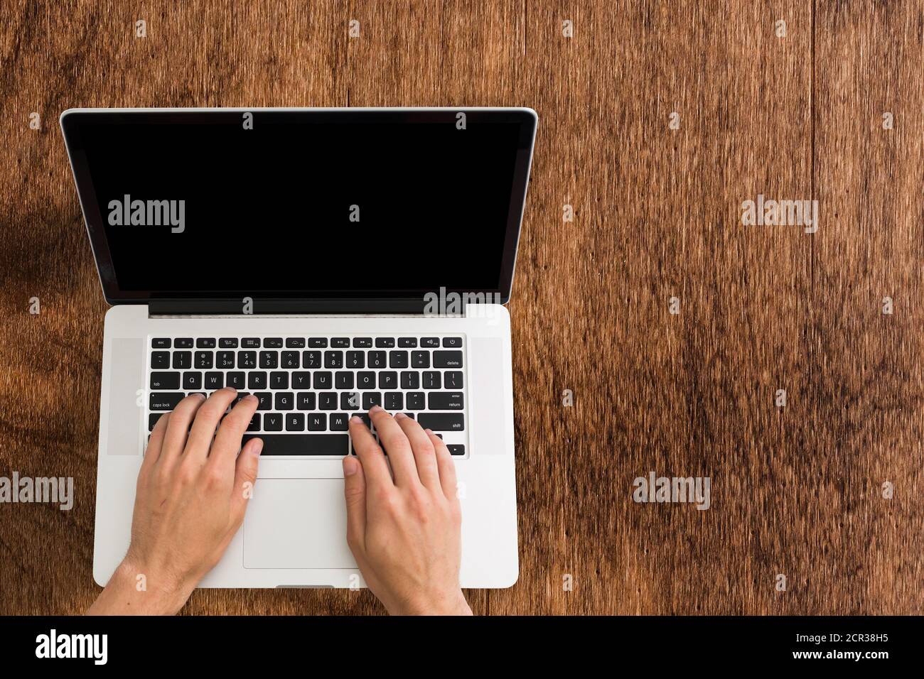 Man hand on laptop keyboard with blank screen monitor Stock Photo - Alamy